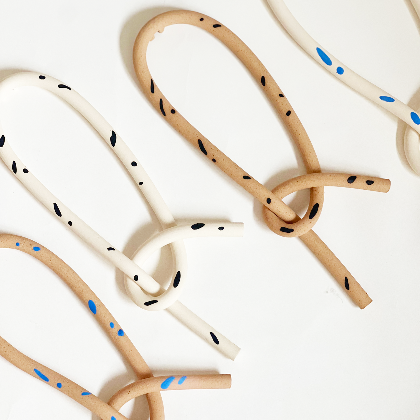Clay Object 25 - Dots Long Knot – O-M Ceramic